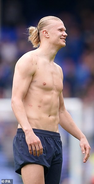 Shirtless Erling Haaland shows off his battle scars from clashes with Yerry Mina, which led to ...