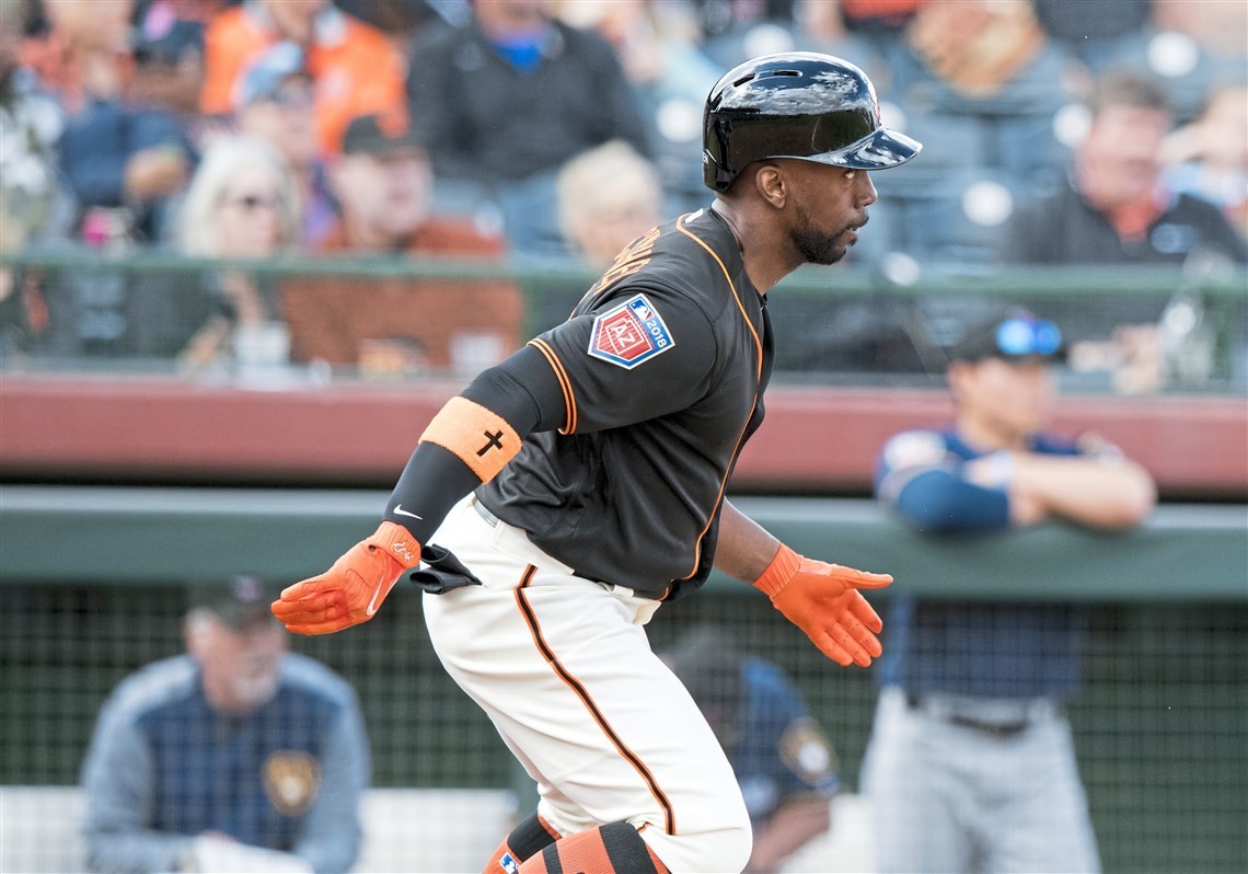 Andrew McCutchen debuts for the Giants. He thinks orange is 'a good look'.