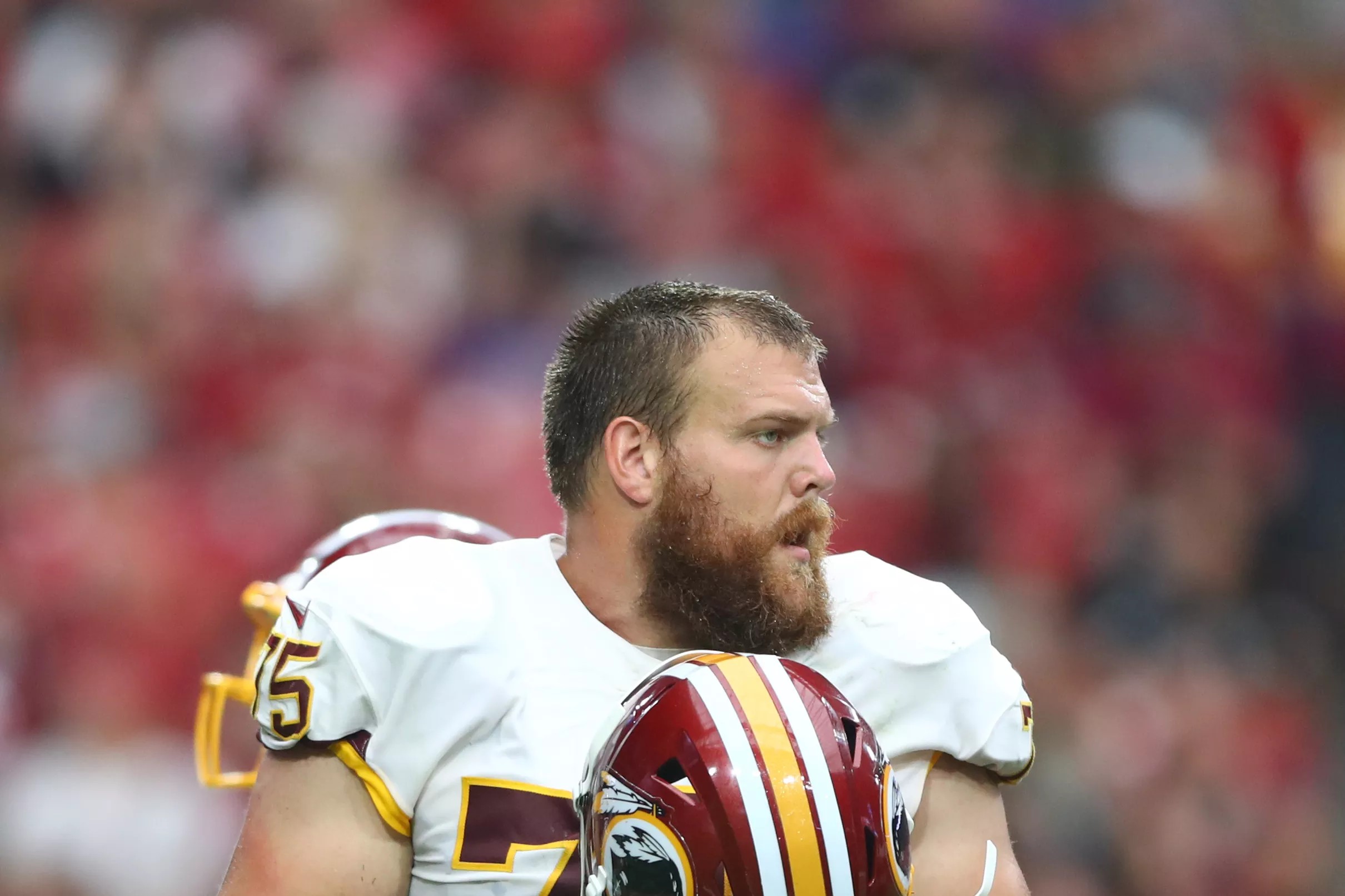 Brandon Scherff is signing his franchise tag tender with the Redskins