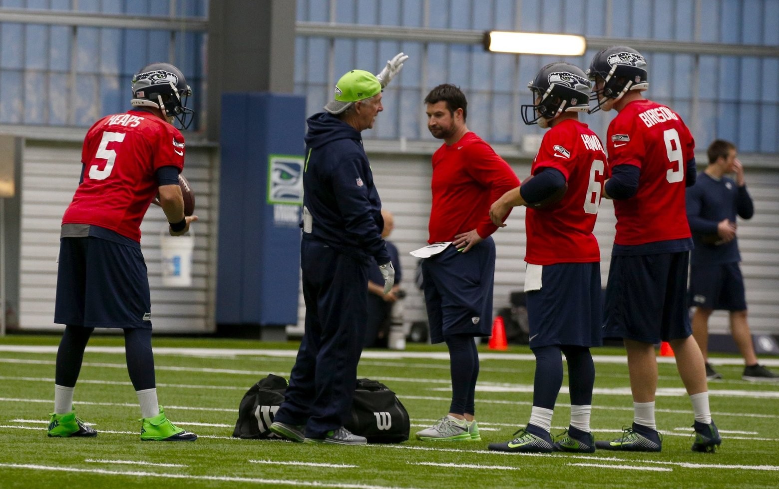 Russell Wilson, Jake Heaps team up on passing academy