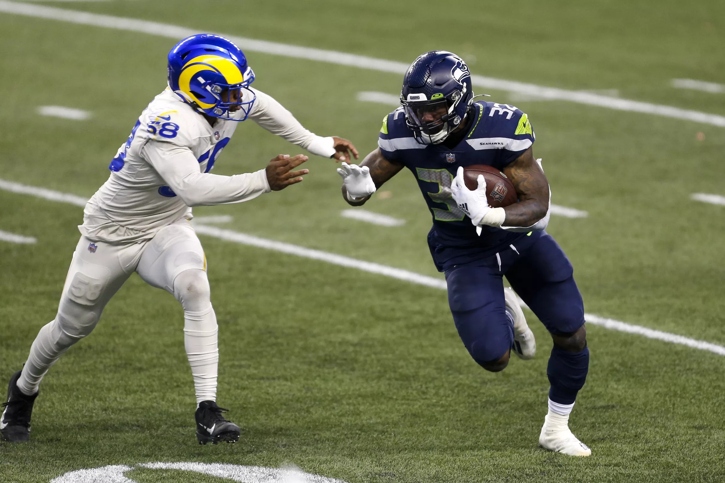Chris Carson’s strength on display in defeating consecutive playoff ...