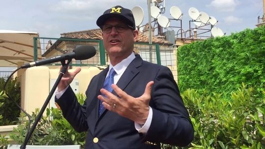 Harbaugh presents Pope Francis with UM helmet