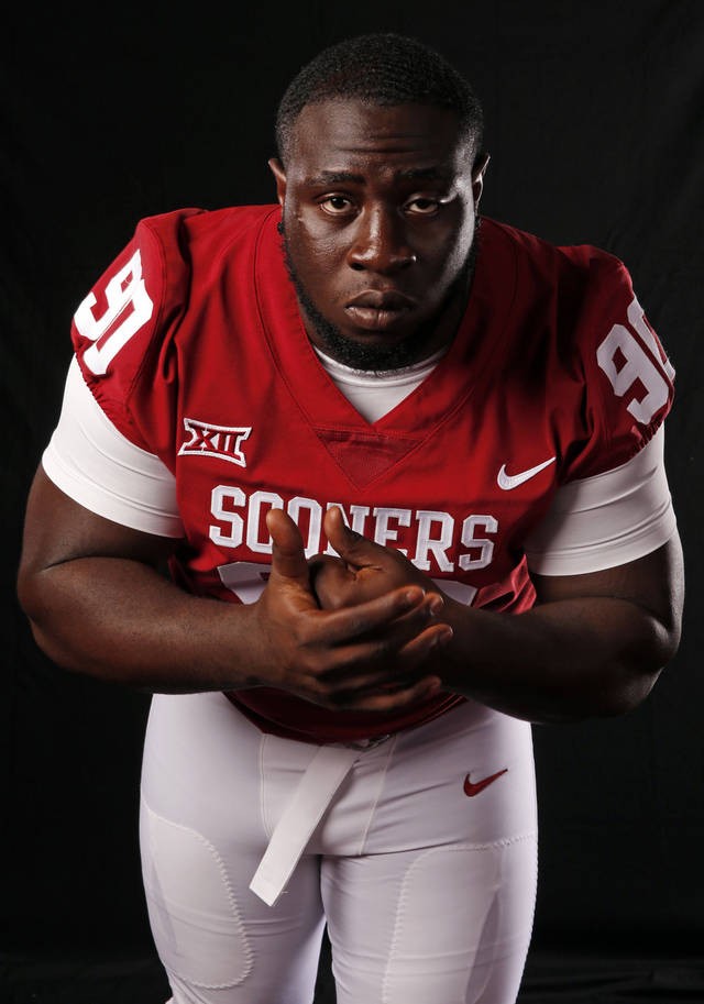 MAN OF MANY NAMES: Neville Gallimore gets comfortable with the Sooners