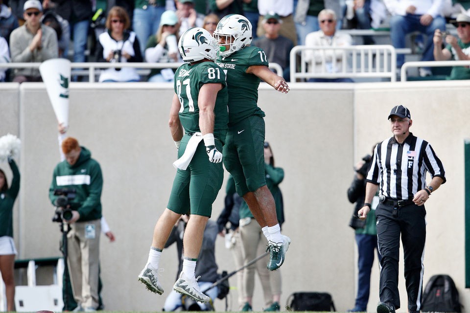 Michigan State moves up in AP rankings, down in Coaches Poll