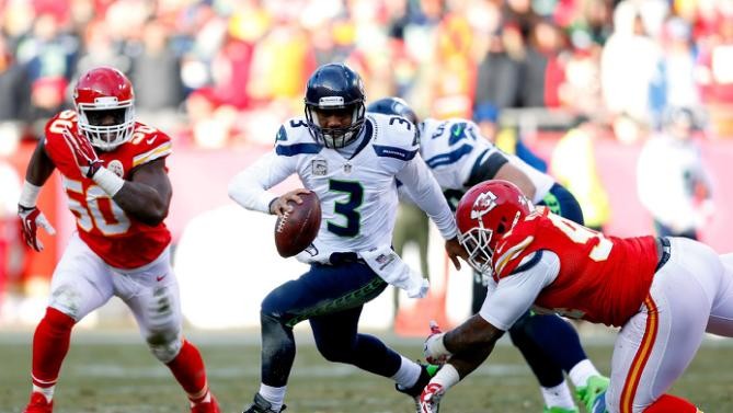 Russell Wilson under pressure in first half vs. Rams