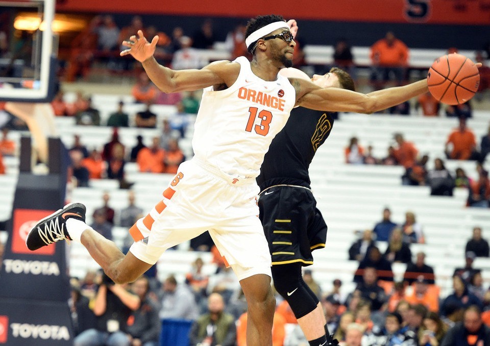 Syracuse center Paschal Chuwku's hustle leads to hurdled fan, booze bath