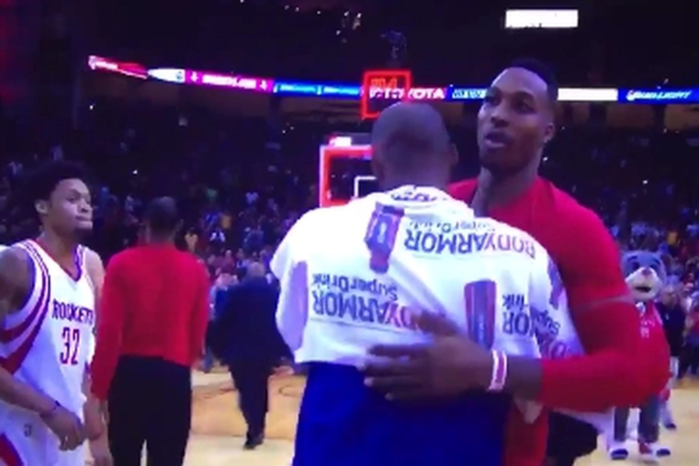 Kobe Bryant and Dwight Howard hugged after the Lakers' loss to the Rockets