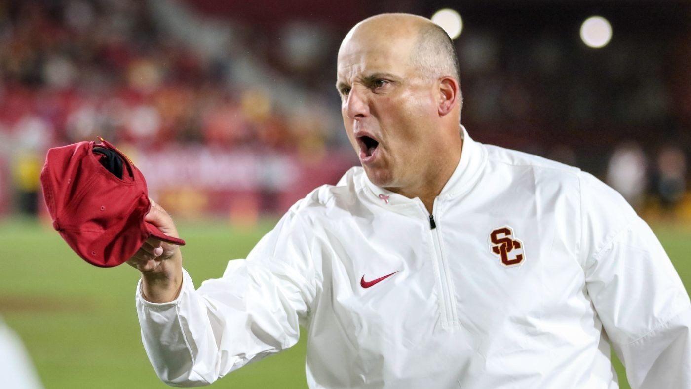 In his battle to fight on, USC's Clay Helton stands as the lone soldier