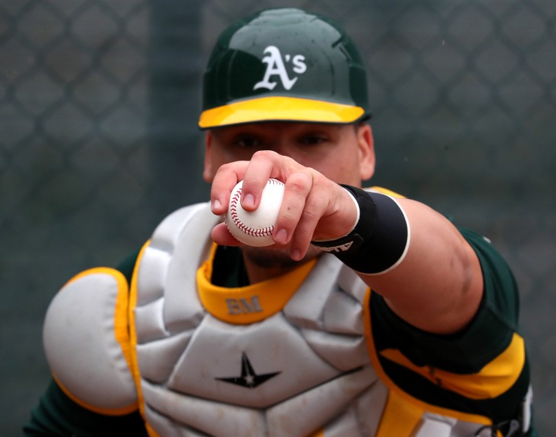 Photos: A’s hold first pitchers and catchers spring training workout