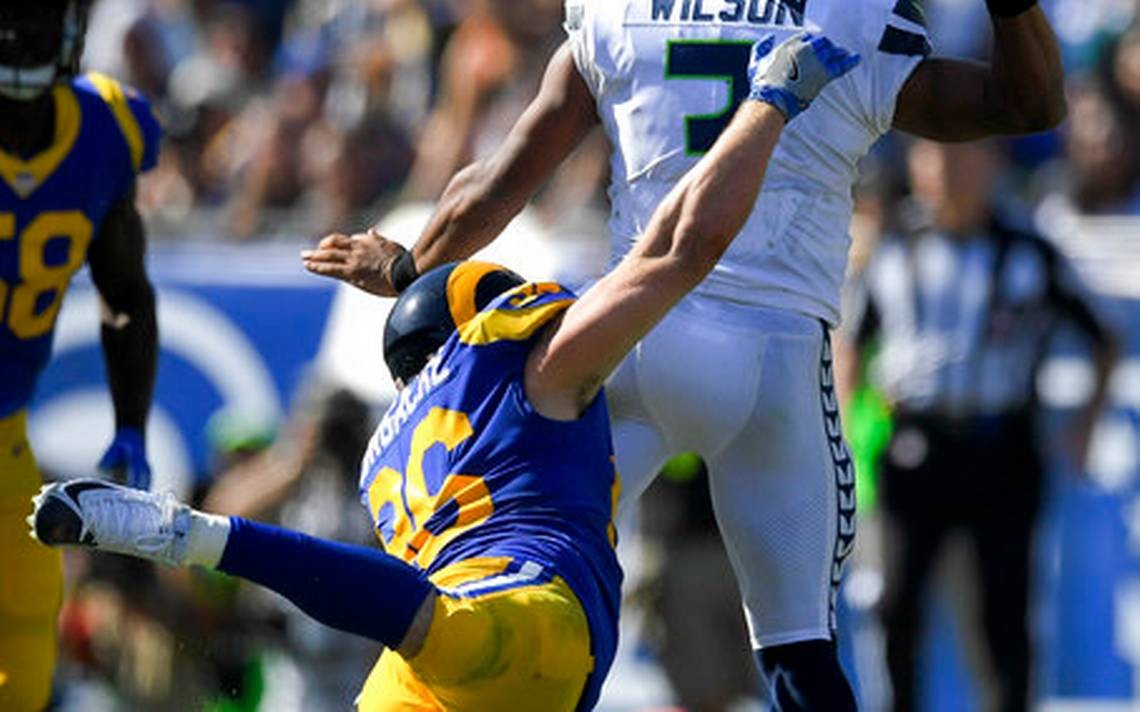 Russell Wilson on his 70-yard run for tackle, more in Seahawks win at Rams