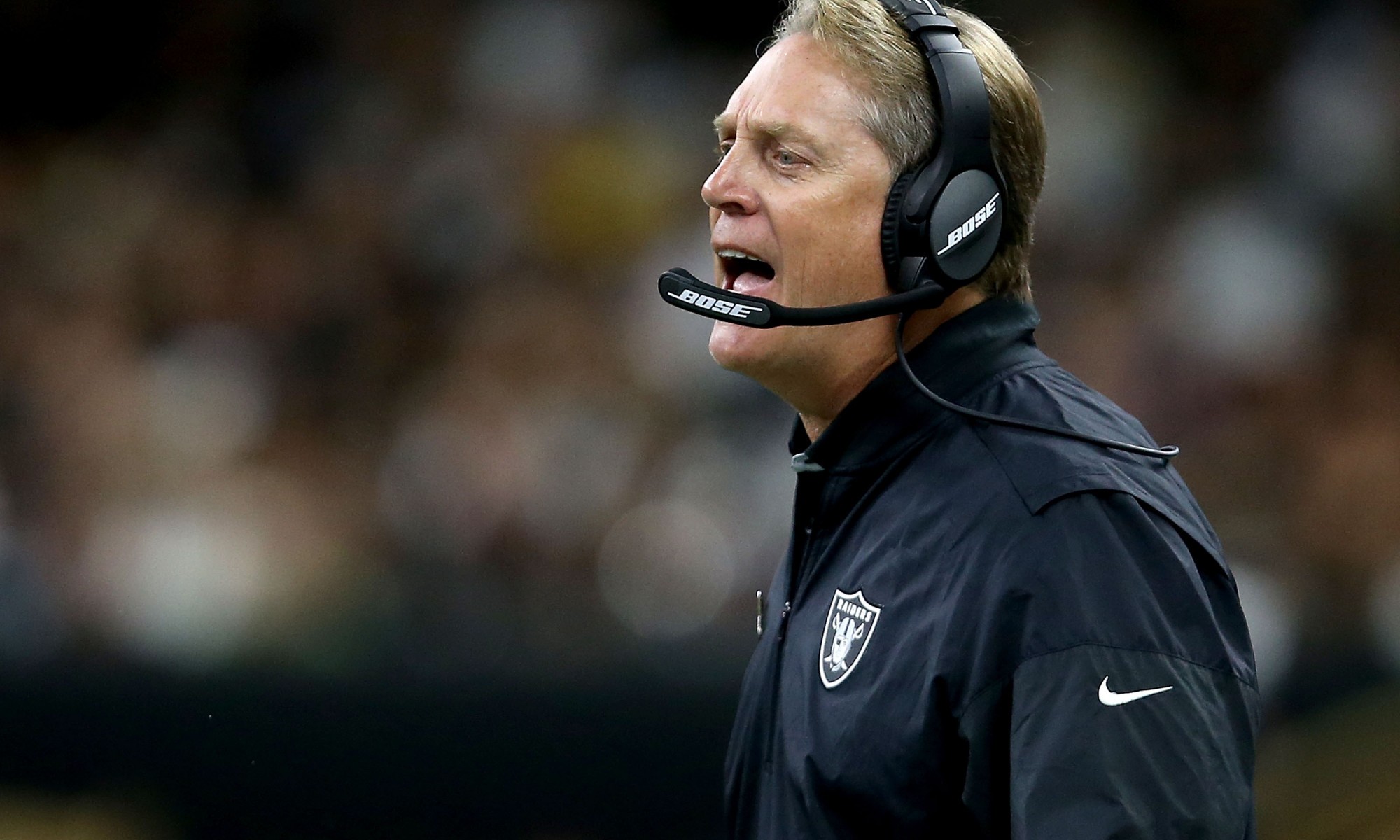 Former Raiders head coach Jack Del Rio observes Saints practice