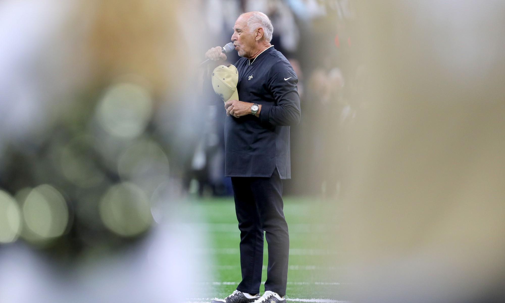 Jimmy Buffett takes Jazz Fest stage in blind referee costume